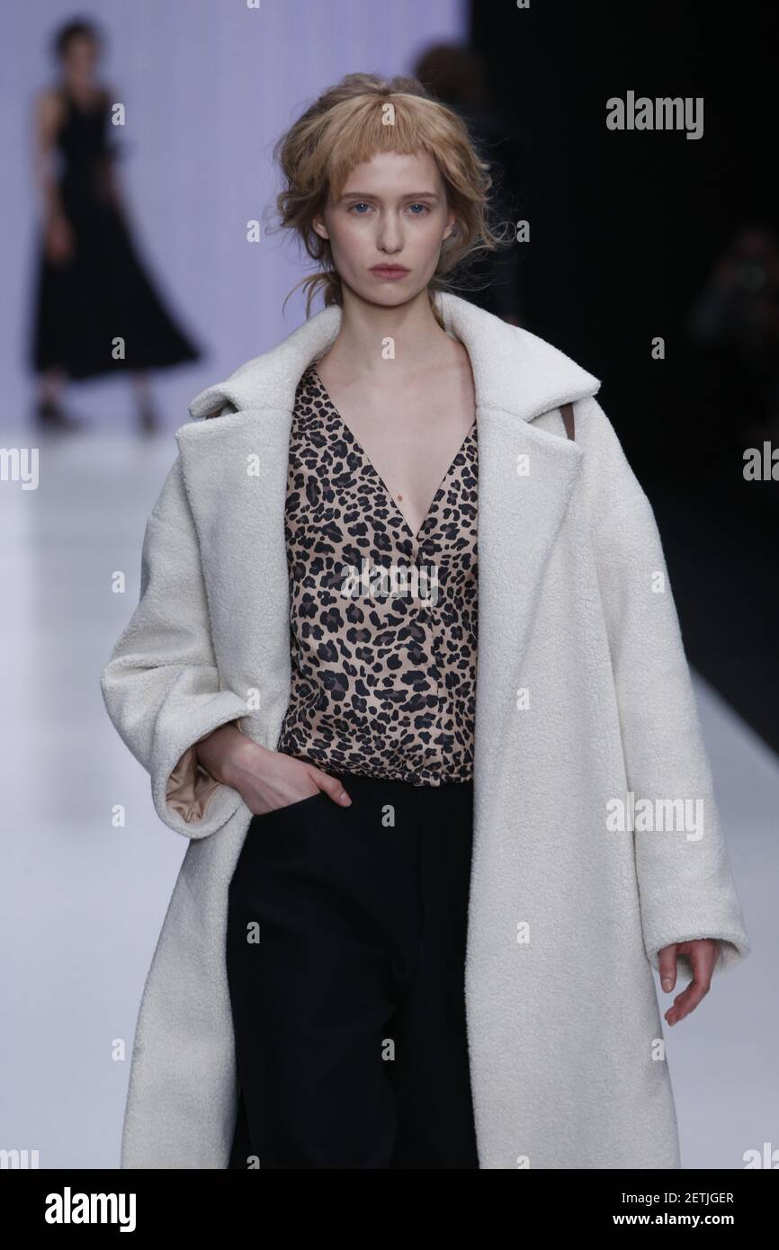 A model walks on the runway during the Yulia Nikolaeva Fashion Show at ...