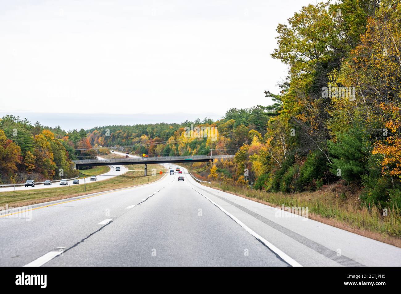 Fascinating colorful winding New Hampshire divided highway road lined ...