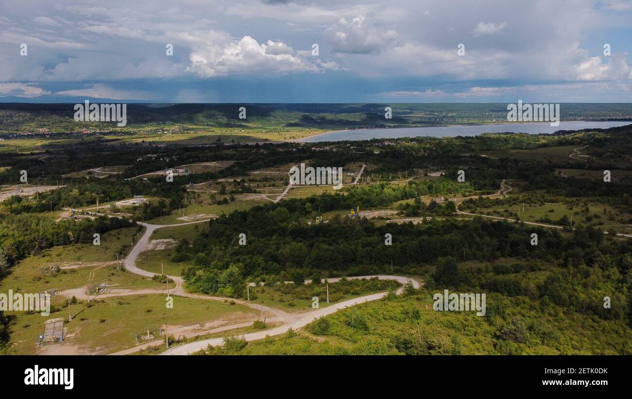 An aerial view of a rural unpaved road winding through a landscape ...