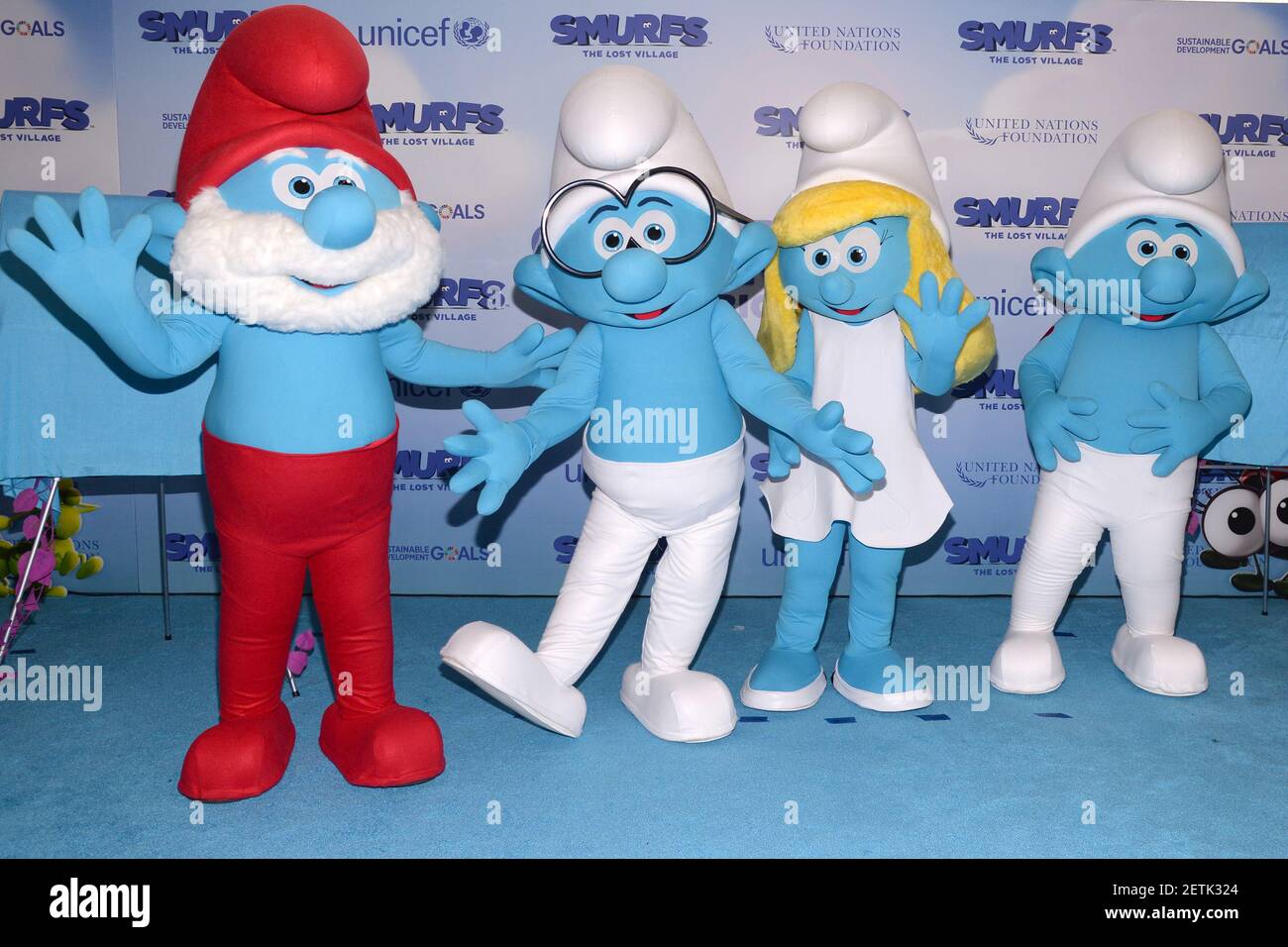 Smurf characters attend the International Day of Happiness in ...