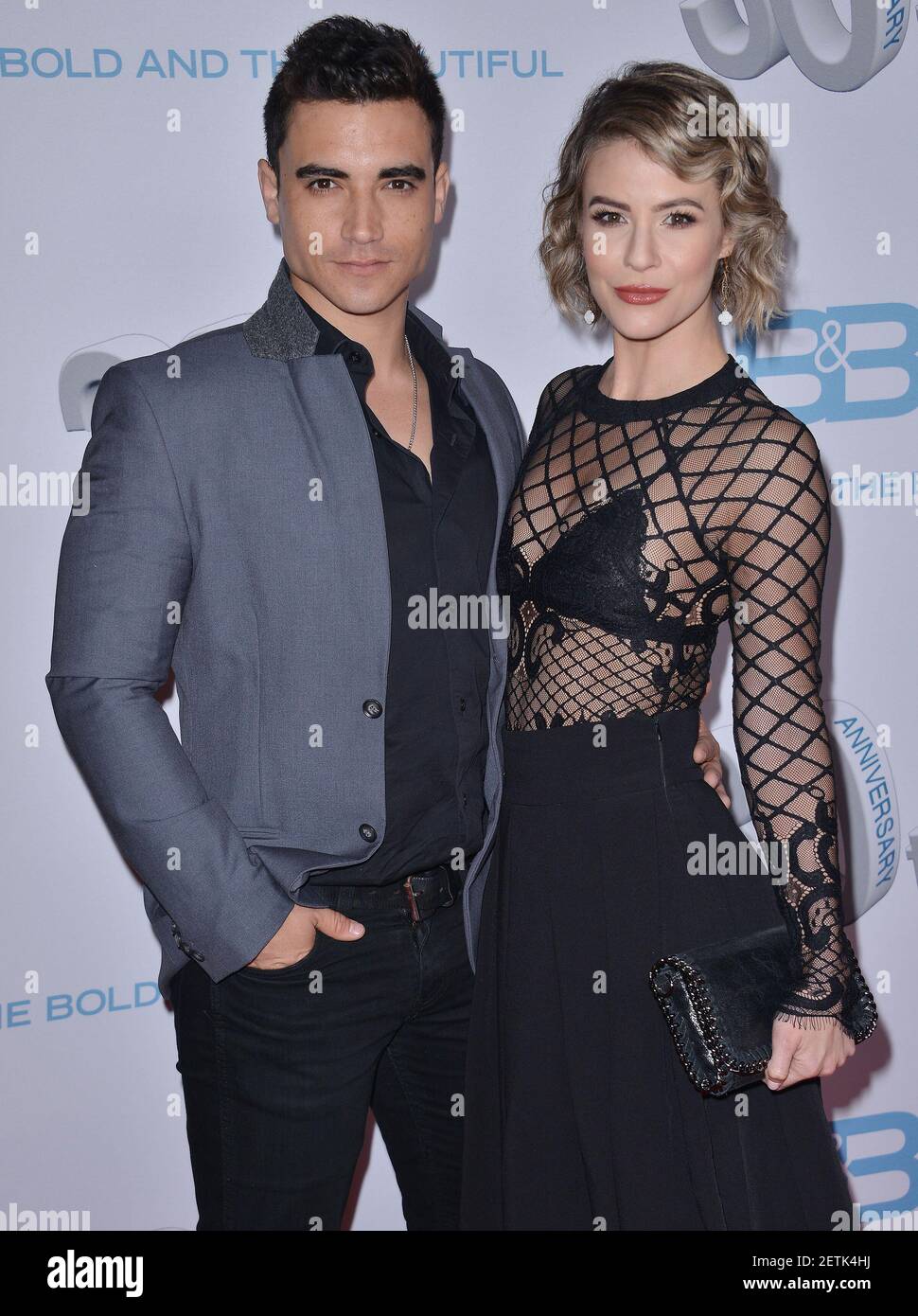 (L-R) Marco James Marquez and Linsey Godfrey arriving at The Bold & the ...