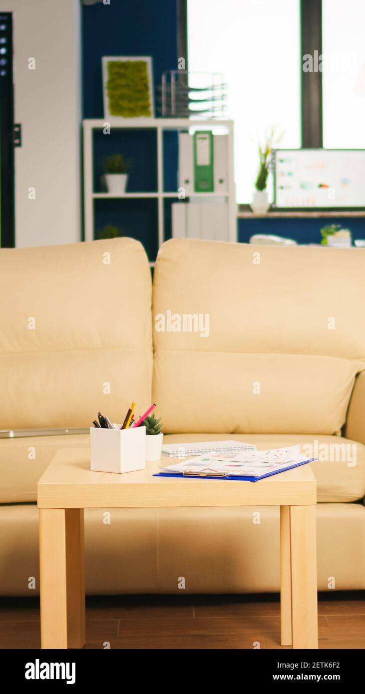 Modern business relax zone interior with confortable couch and orange ...