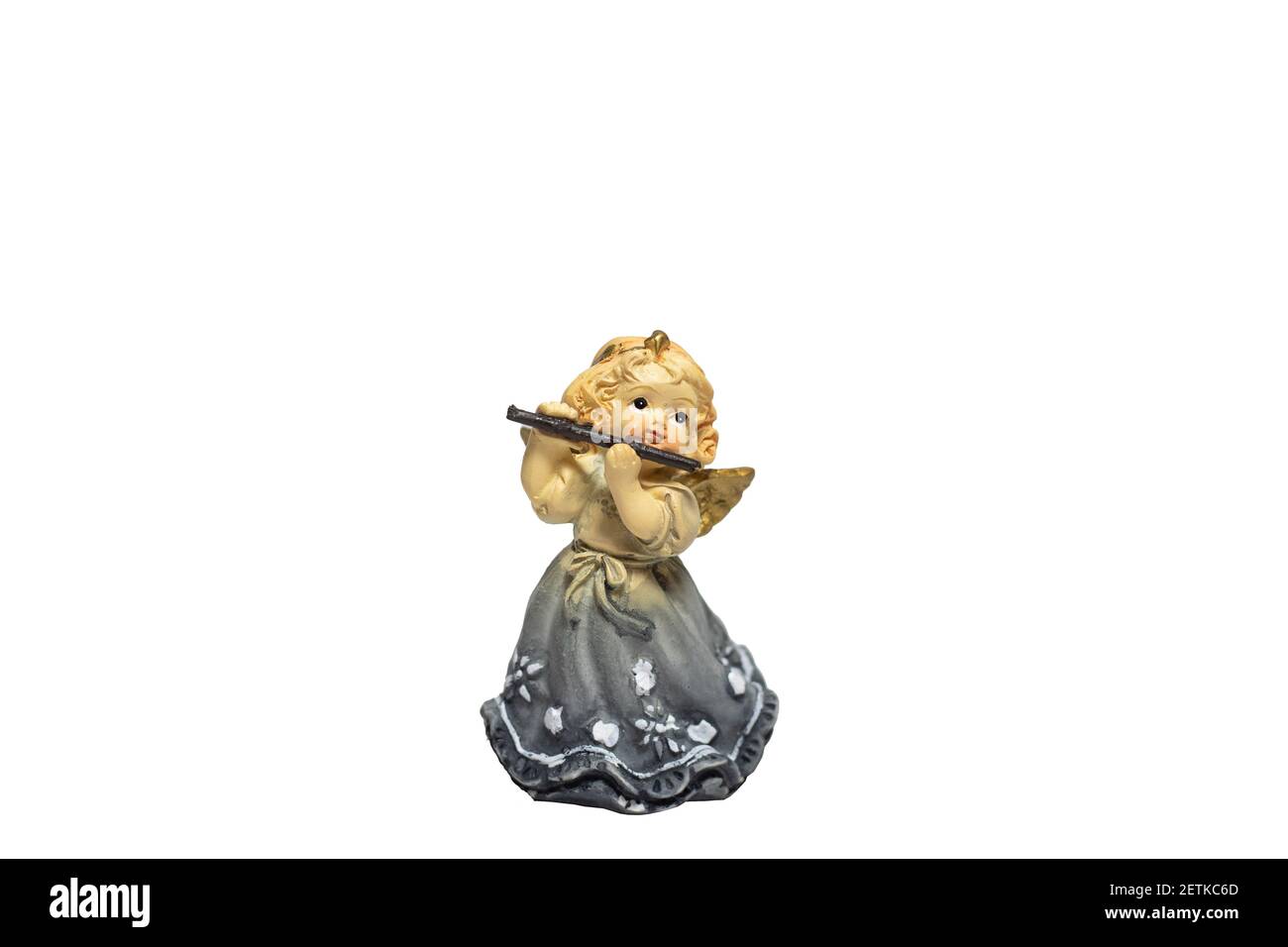 Statuette of an angel girl with a flute isolated on a white background ...