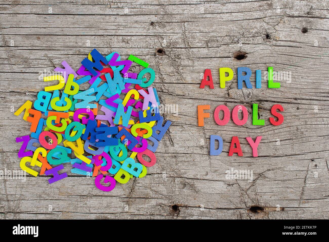 April fools day colorful wooden letters alphabet on wooden rustic ...
