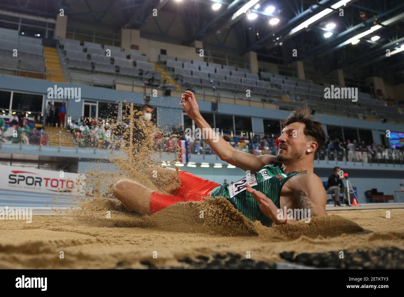 ISTANBUL, TURKEY - FEBRUARY 20, 2021: Undefined athlete long jumping ...