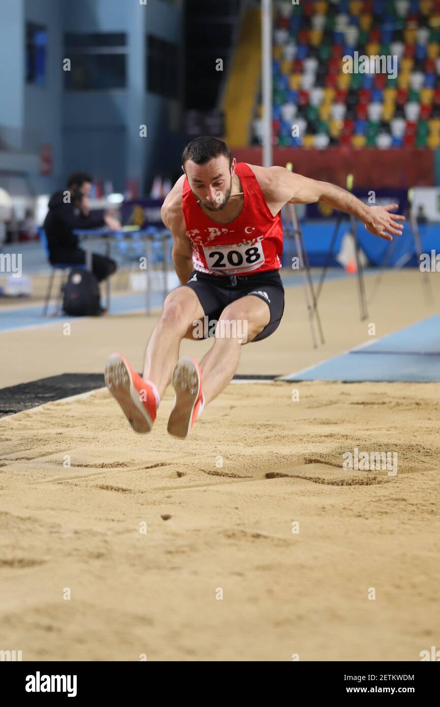 ISTANBUL, TURKEY - FEBRUARY 20, 2021: Undefined athlete long jumping ...