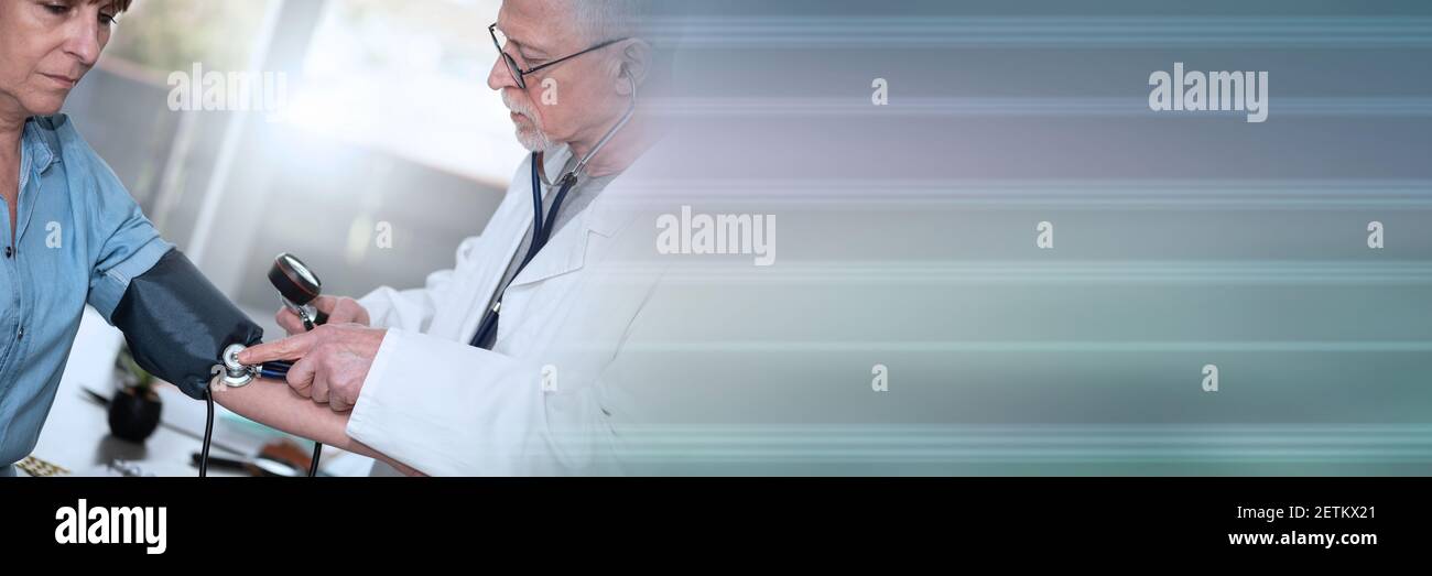 Doctor measuring blood pressure of a female patient; panoramic banner ...