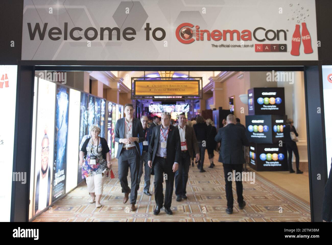 Attendees walk on the trade show floor during CinemaCon at Caesars ...