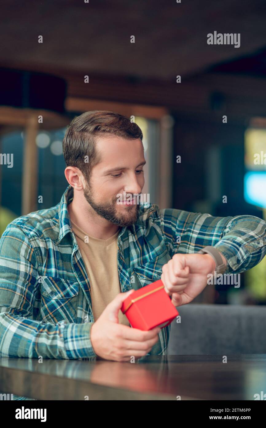 Young man small gift box hi-res stock photography and images - Alamy