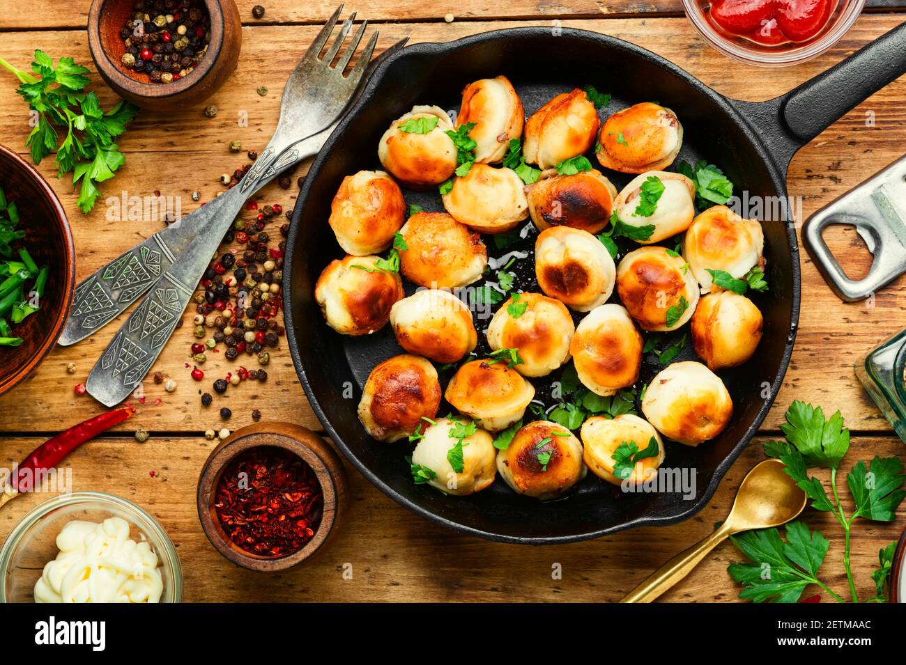 Frying pan with roasted tasty pelmeni.Fried dumplings Stock Photo - Alamy
