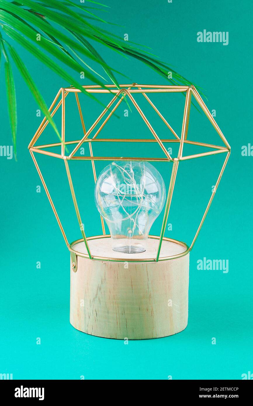 Modern geometric lamp with copper wire lampshade. Metal frame of the ...