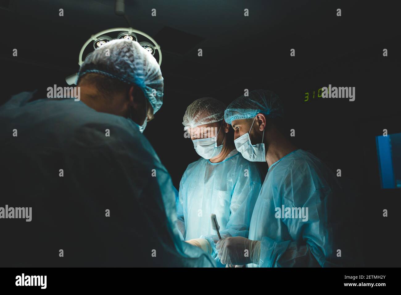 An international professional team of surgeon, assistants and ...