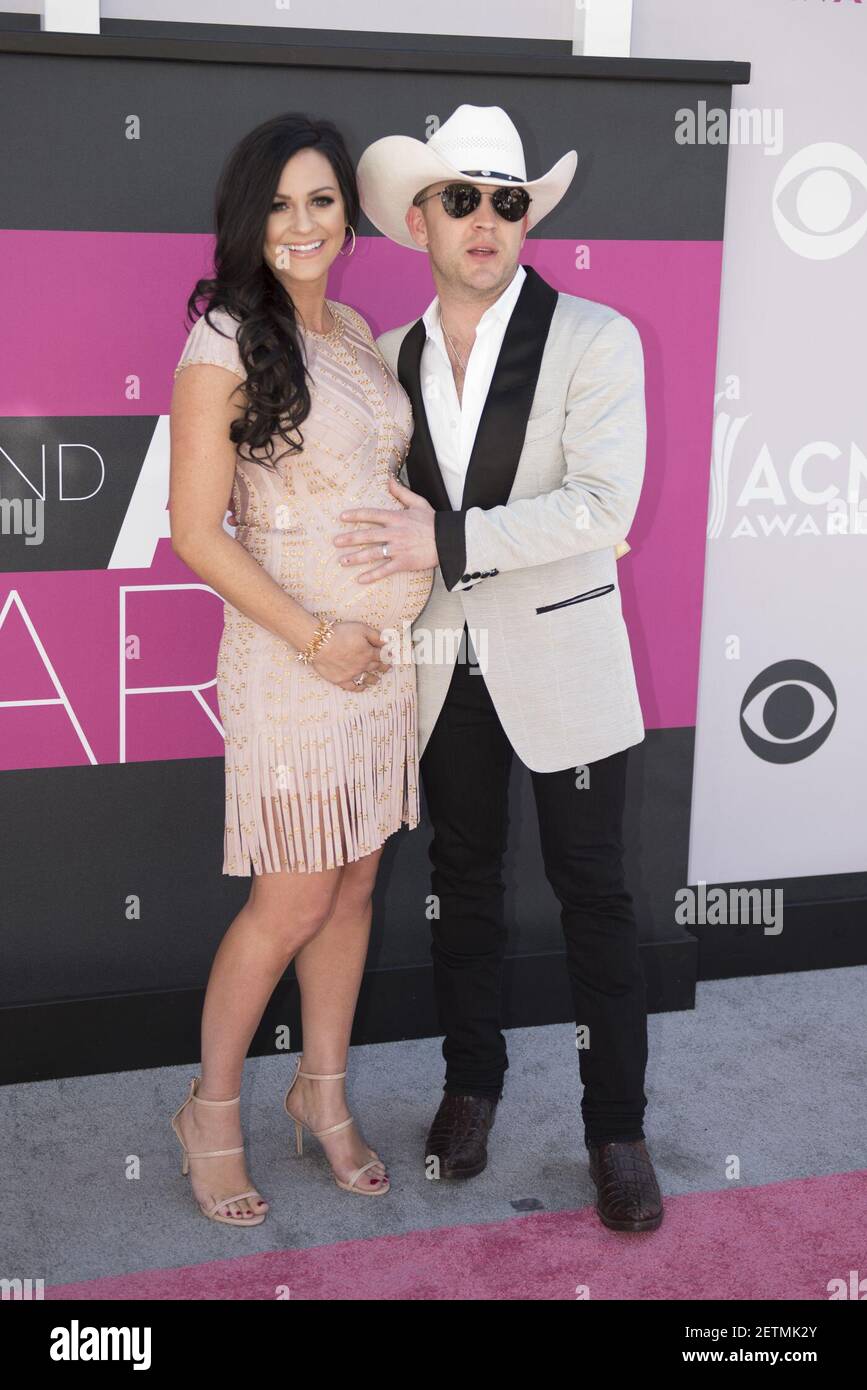 Kate Moore, left, and Justin Moore arrive on the red carpet at the ...