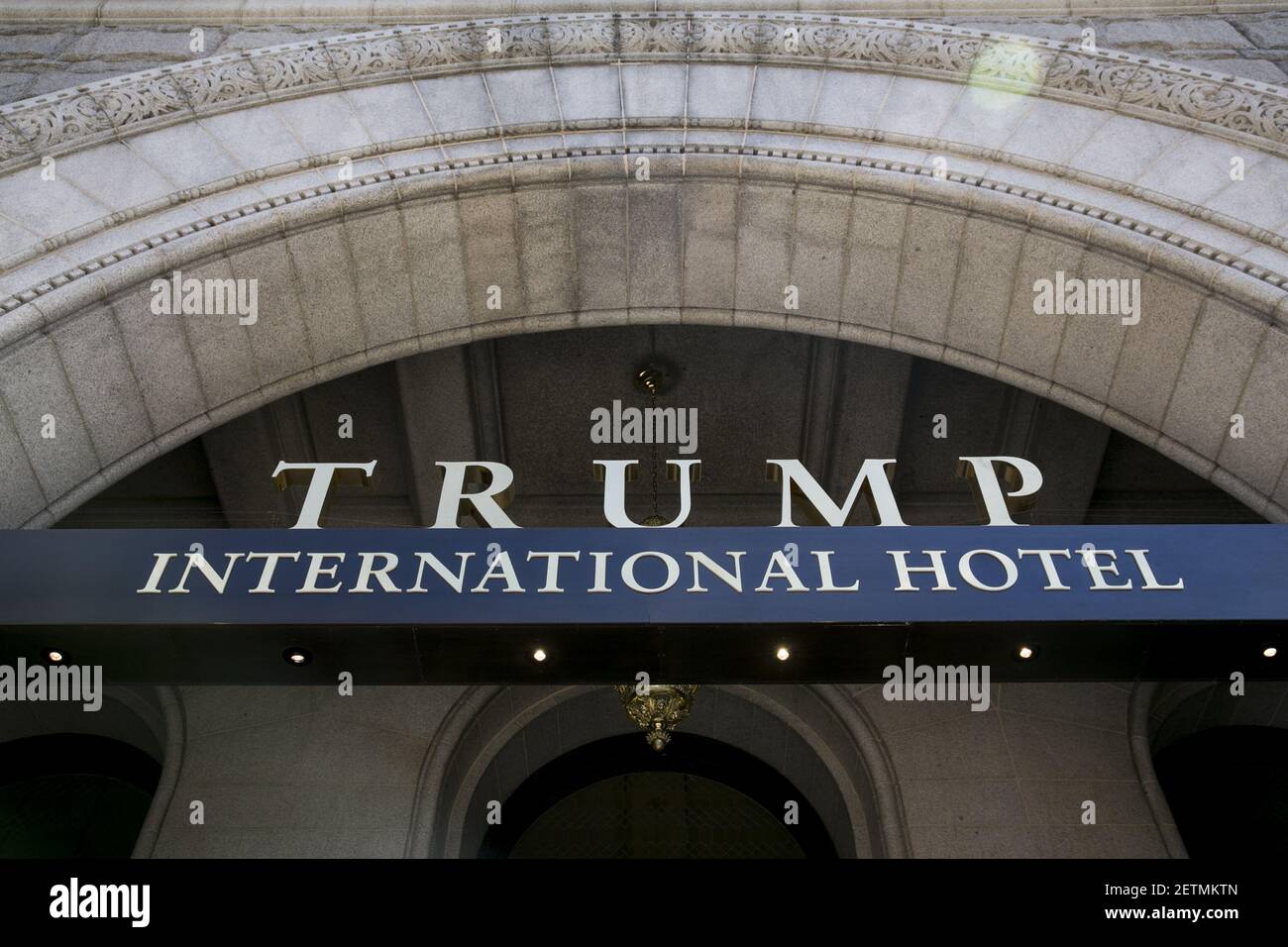 A logo sign outside of the Trump International Hotel in the Old Post ...