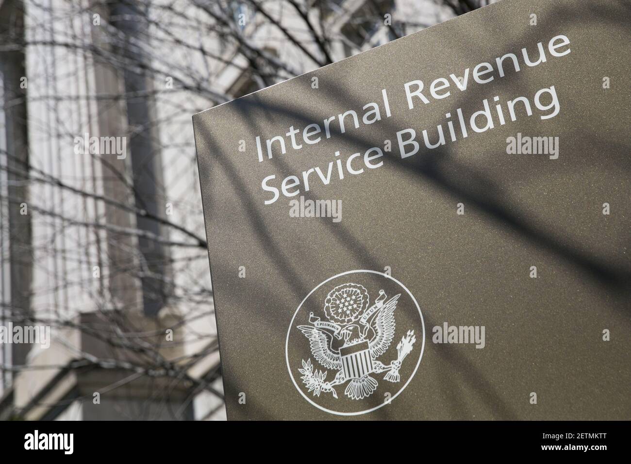 A logo sign outside of the headquarters of the Internal Revenue Service ...