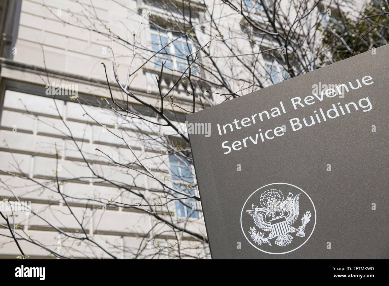 A logo sign outside of the headquarters of the Internal Revenue Service ...