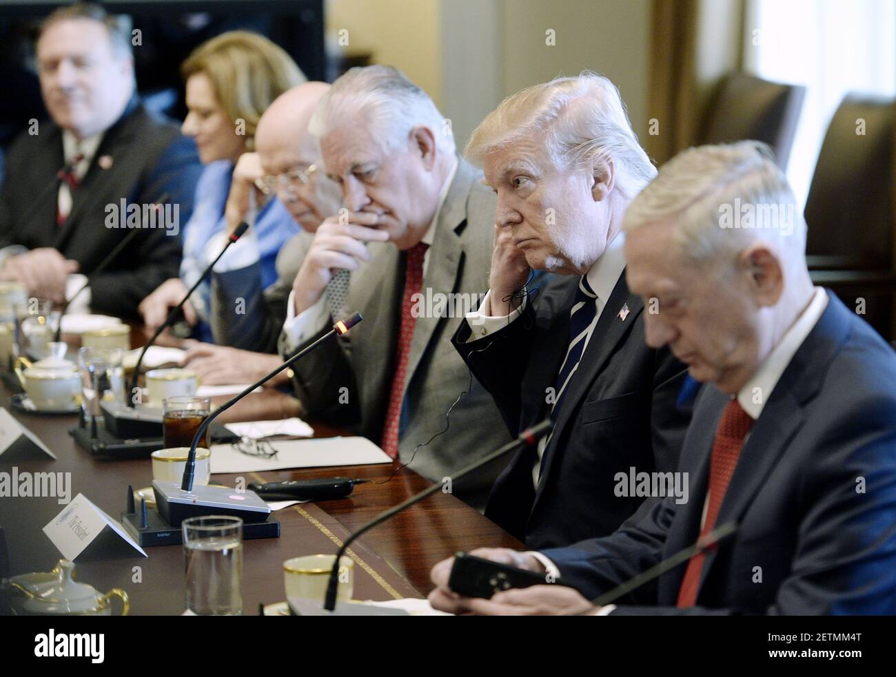 US President Donald Trump flanked by Secretary of State Rex Tillerson ...