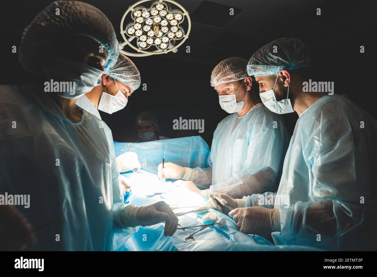 An international professional team of surgeon, assistants and ...