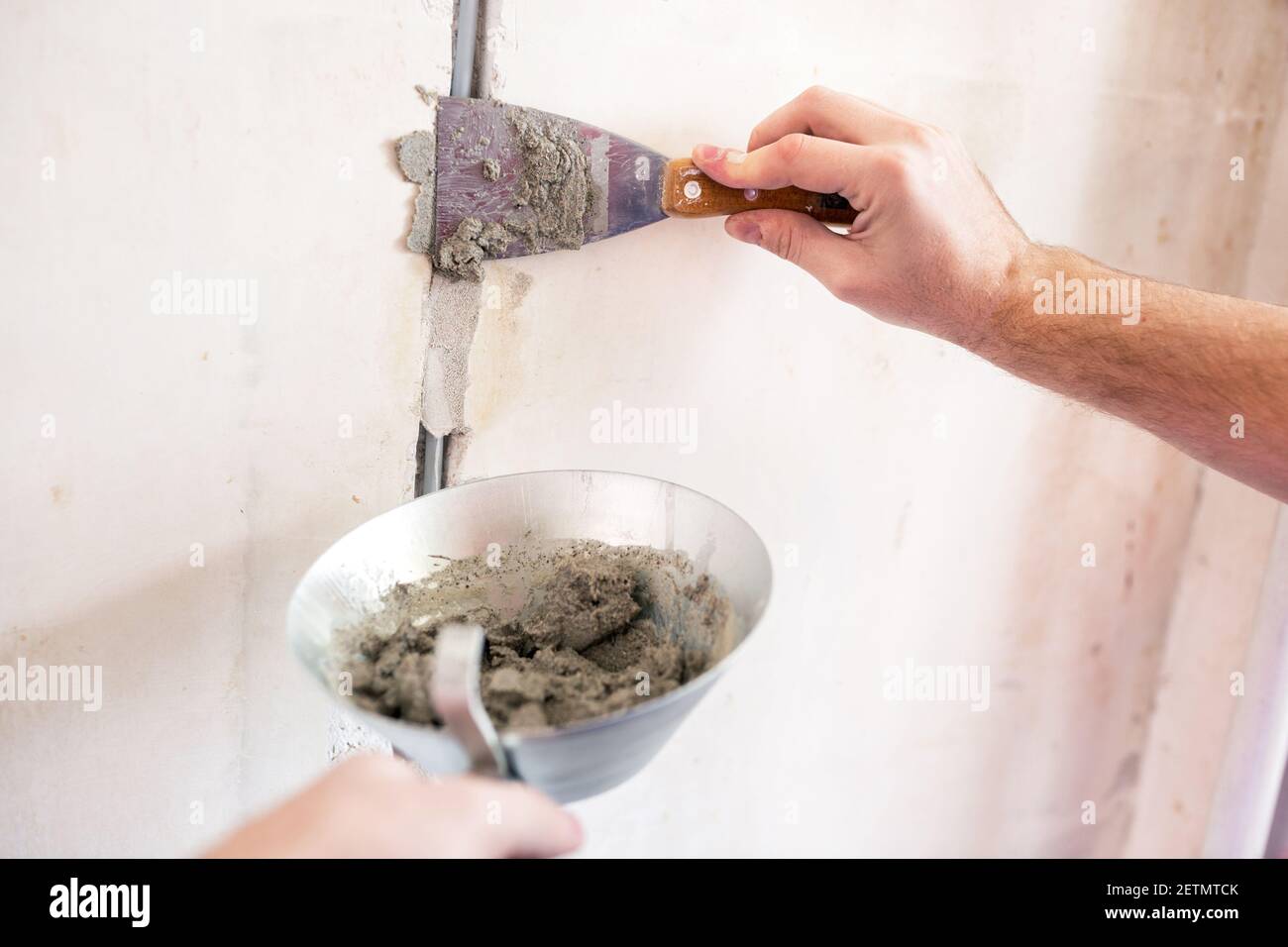 Applying of gypsum cement electric installation finishing touches using ...