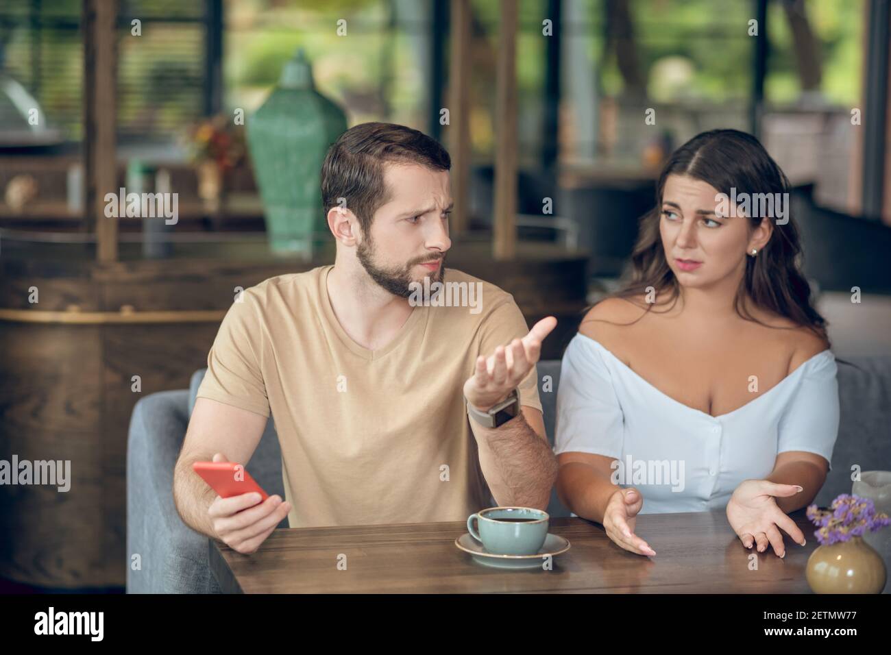 Woman talking inattentive man hi-res stock photography and images - Alamy