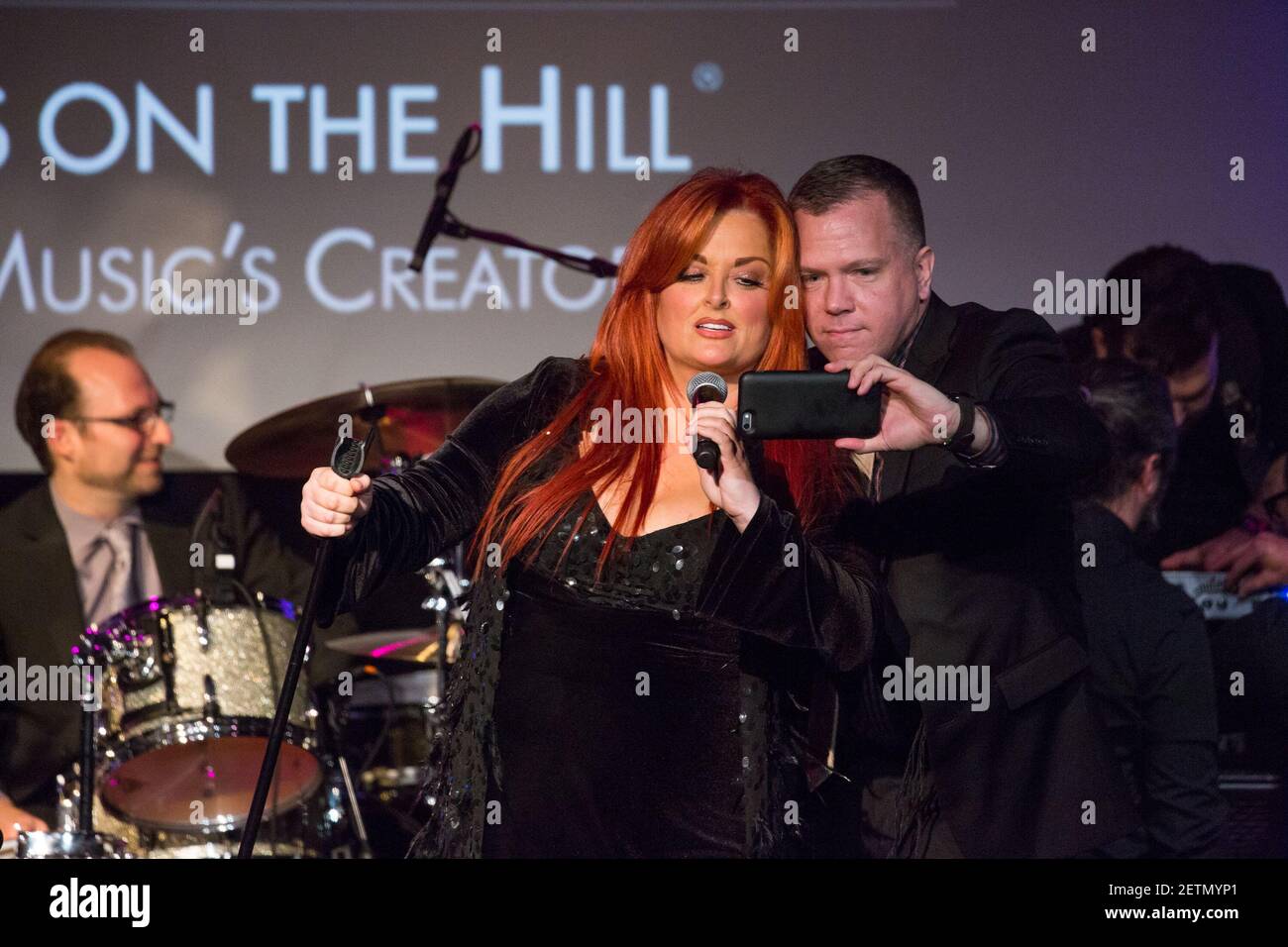 Singer Wynonna Judd, invited a guest to the stage to take a selfie with ...