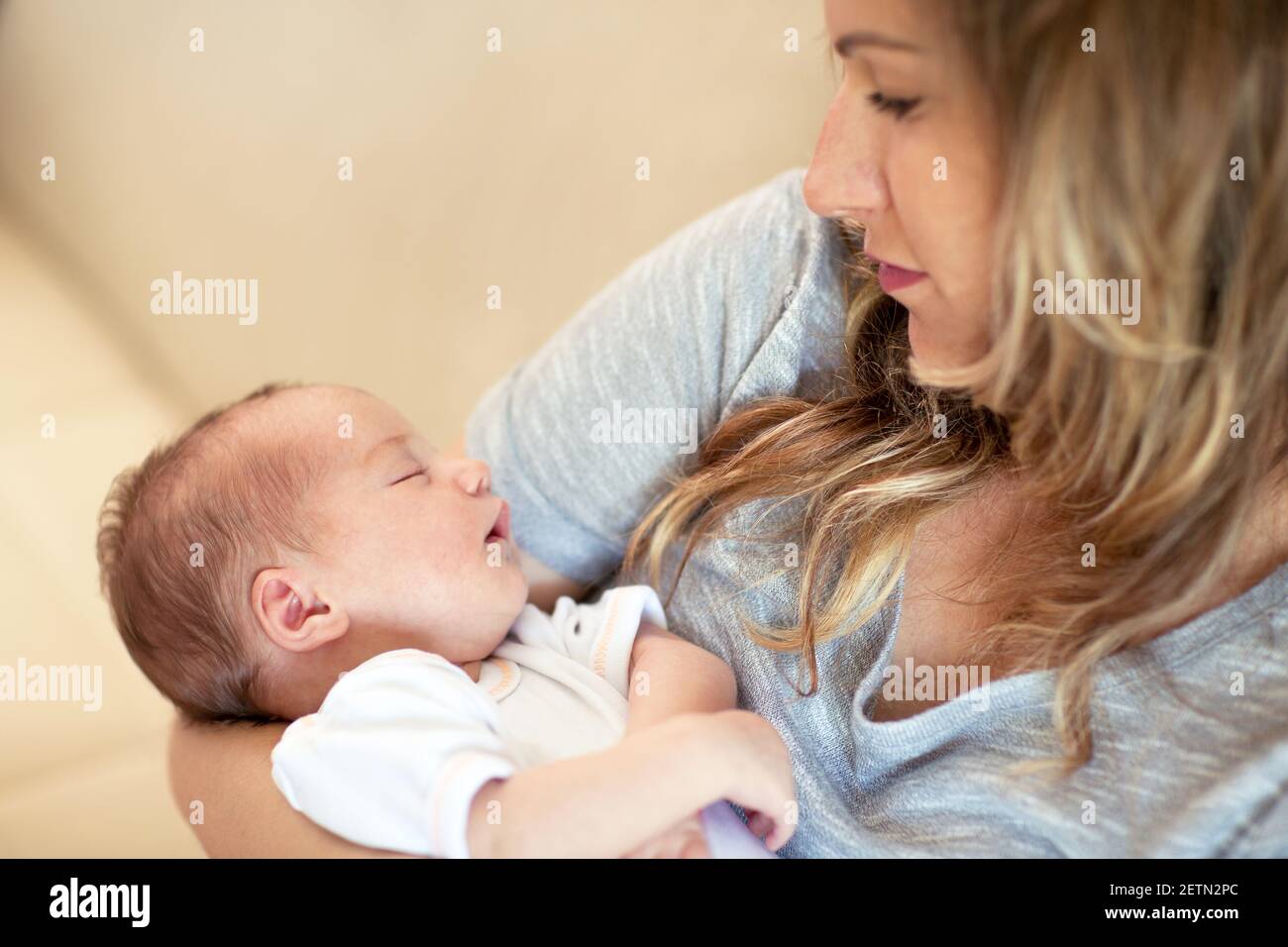 Forming trust and bonding together between young caring mom and her ...