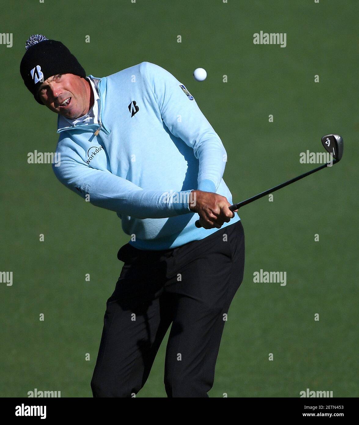 Matt Kuchar chips his ball onto the 2nd green during the second round ...