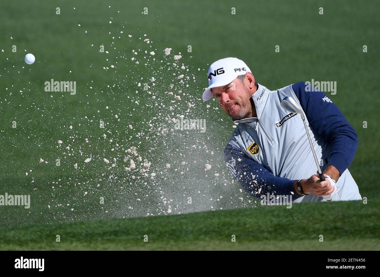 Lee Westwood hits out of a sand trap at the 2nd green during the second ...