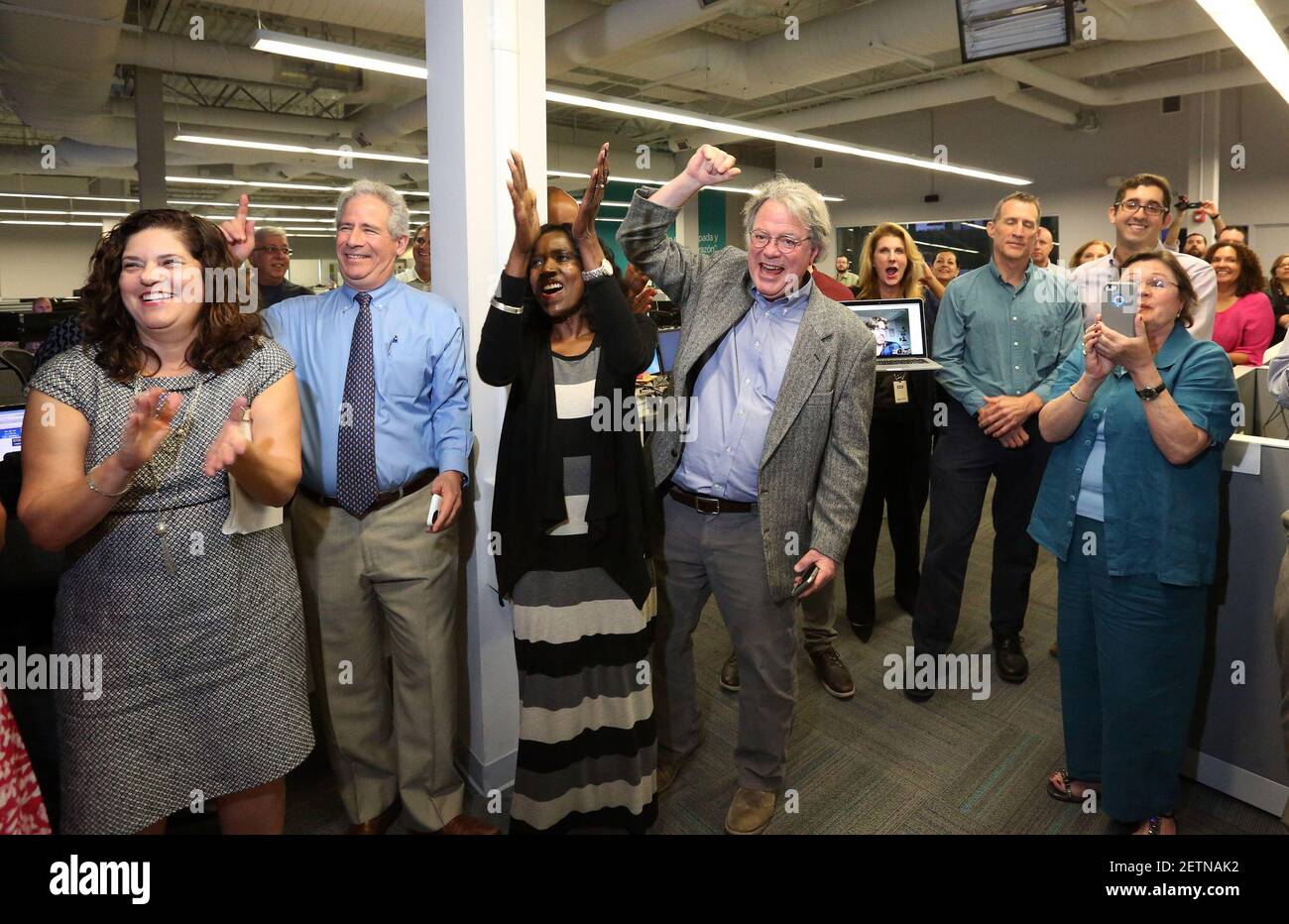 The Miami Herald newsroom reacts to the the first of two Pulitzer Prize ...