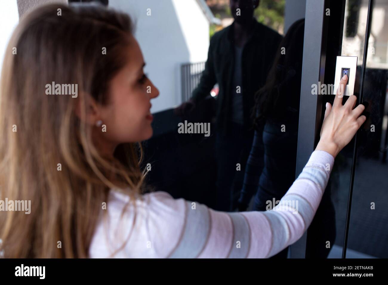 Black finger pressing doorbell hi-res stock photography and images - Alamy