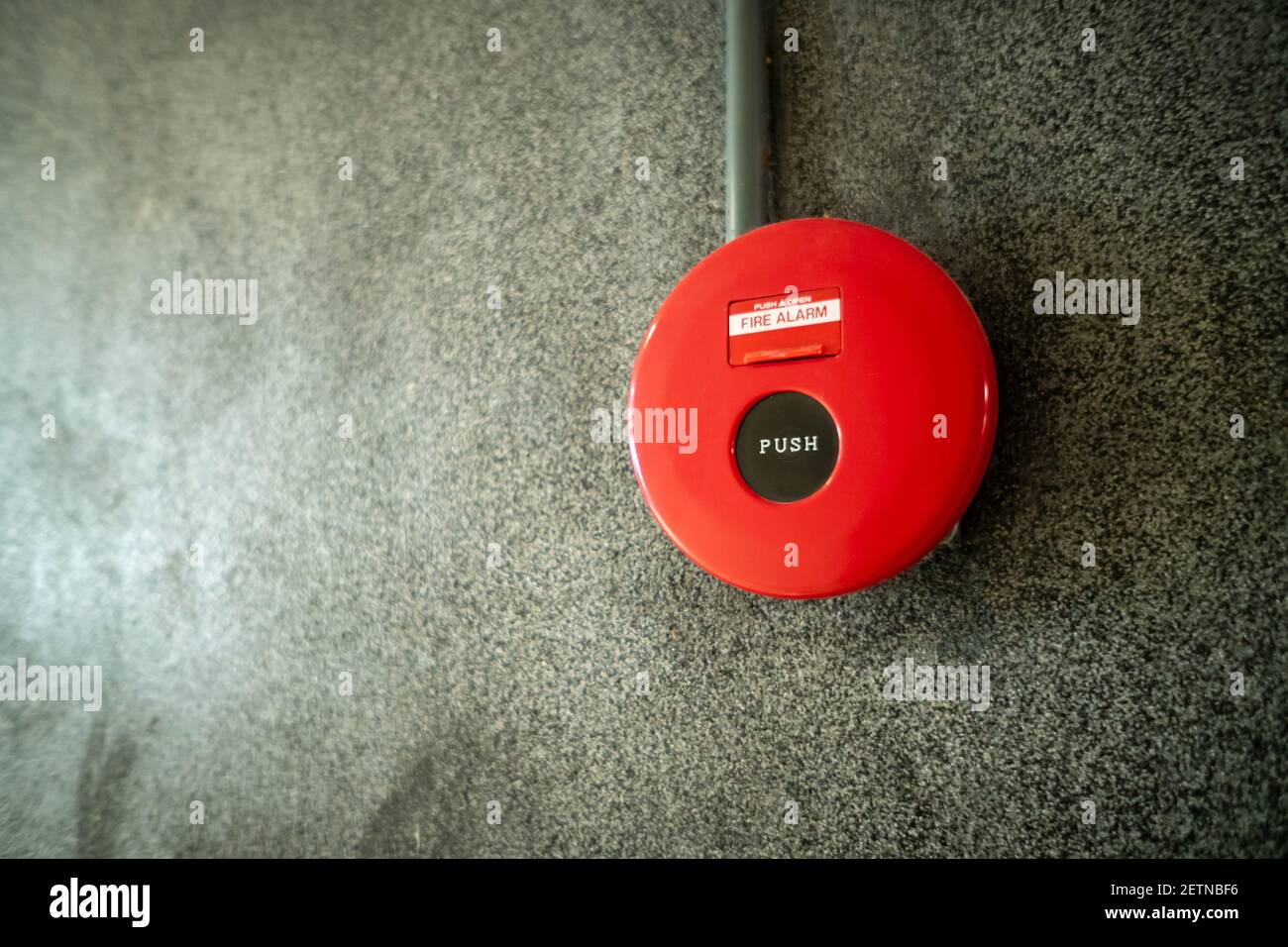 Press the fire alarm on the wall Stock Photo - Alamy