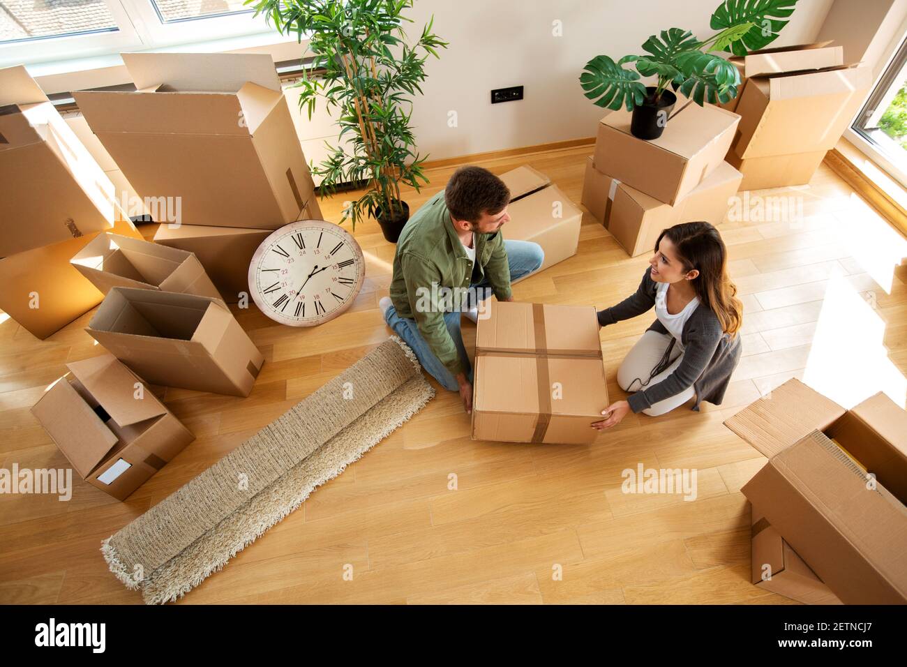 New apartment and the new inhabitants just moving in Stock Photo - Alamy