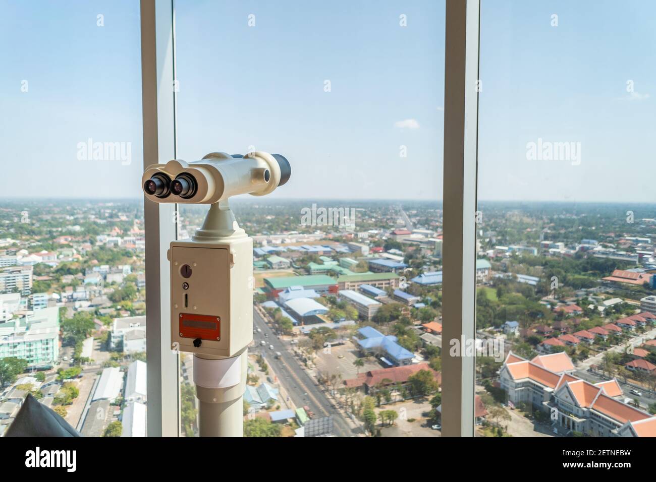 Binocular on top of the building on rooftop viewing tower over building ...