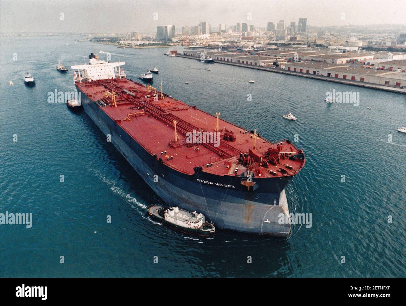 The beleaguered Exxon Valdez, escorted by tugs and Coast GUard vessels ...