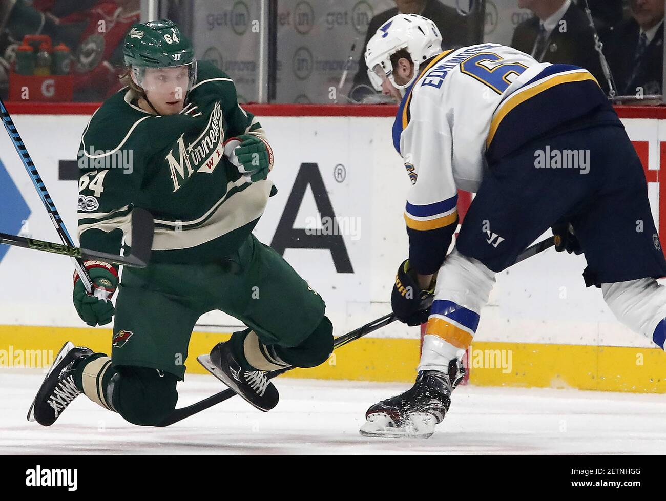 The Minnesota Wild's Mikael Granlund (64) is tripped up by the St ...