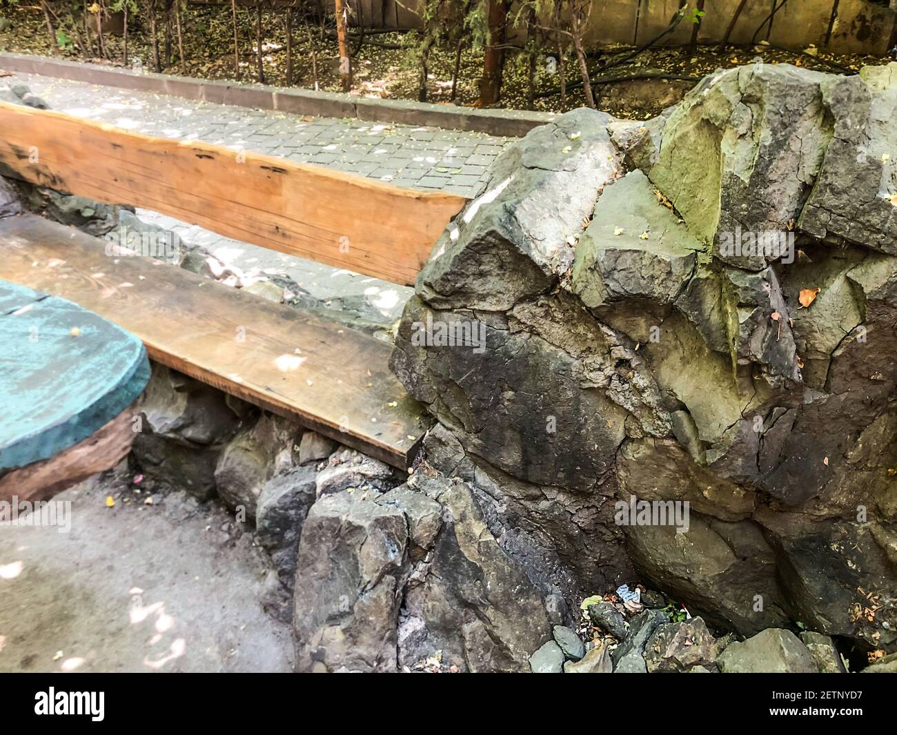 Long wooden bench in the garden Stock Photo - Alamy