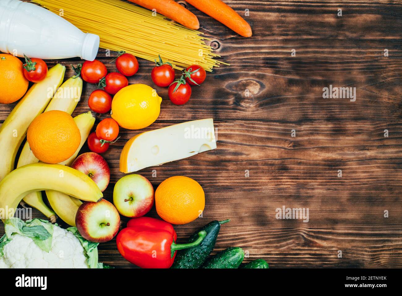 top view set of food vegetables fruits dairy products on wooden ...