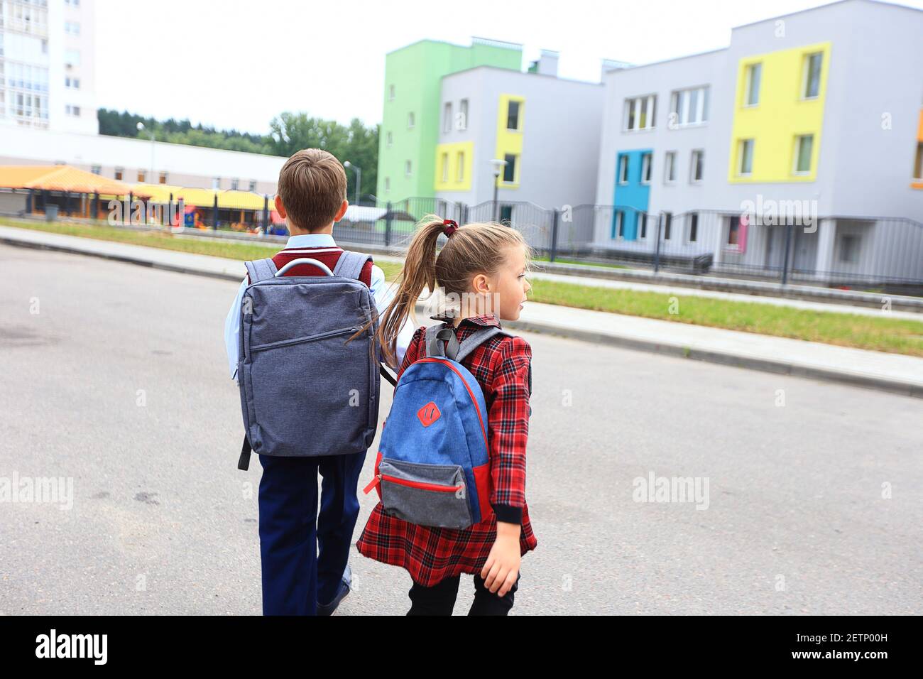 Children with briefcases over their shoulders on the background of the ...