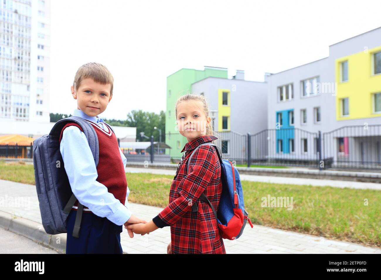 Children with briefcases over their shoulders on the background of the ...