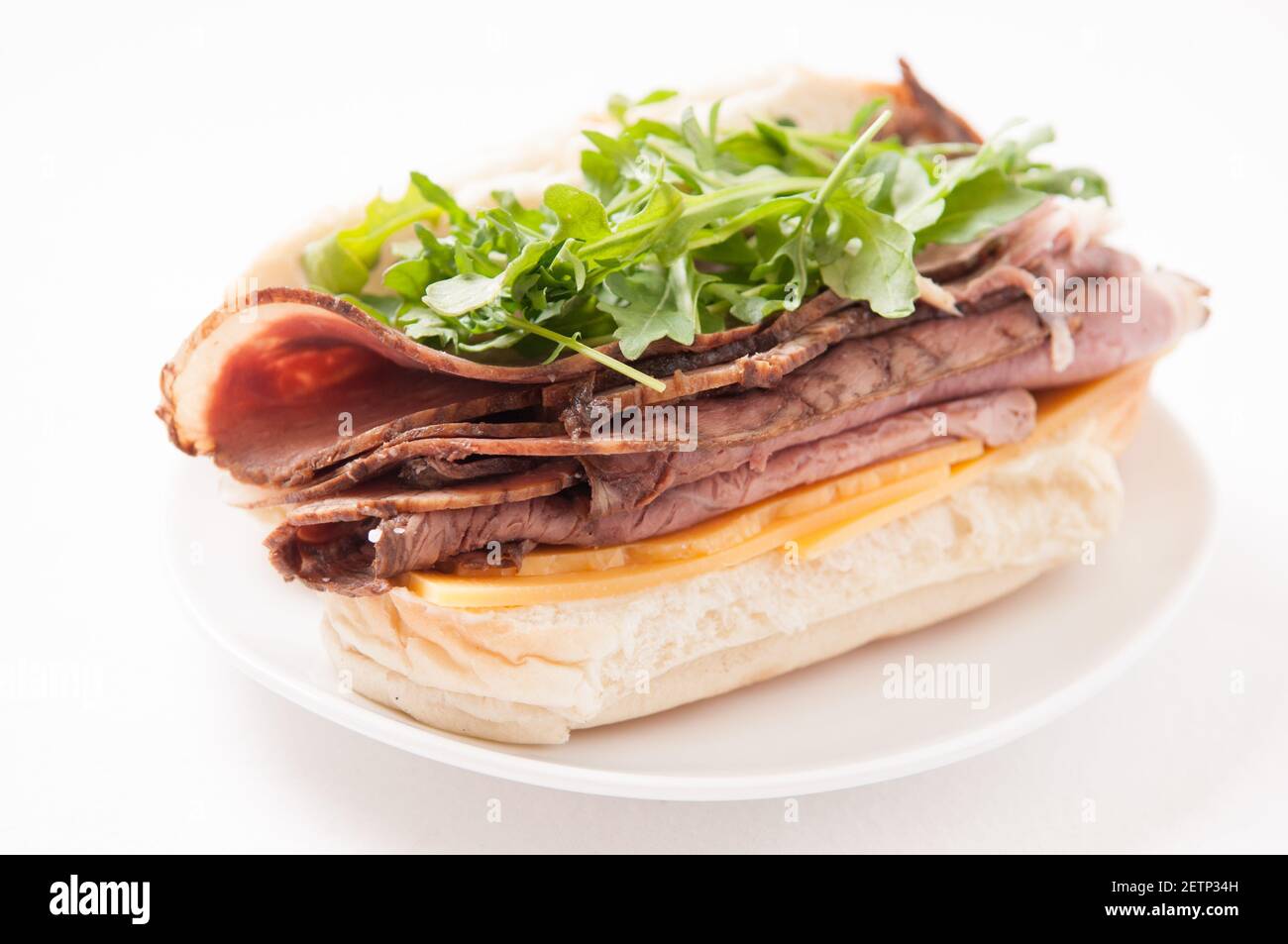 rare roast beef on a submarine bun with cheddar cheese Stock Photo - Alamy