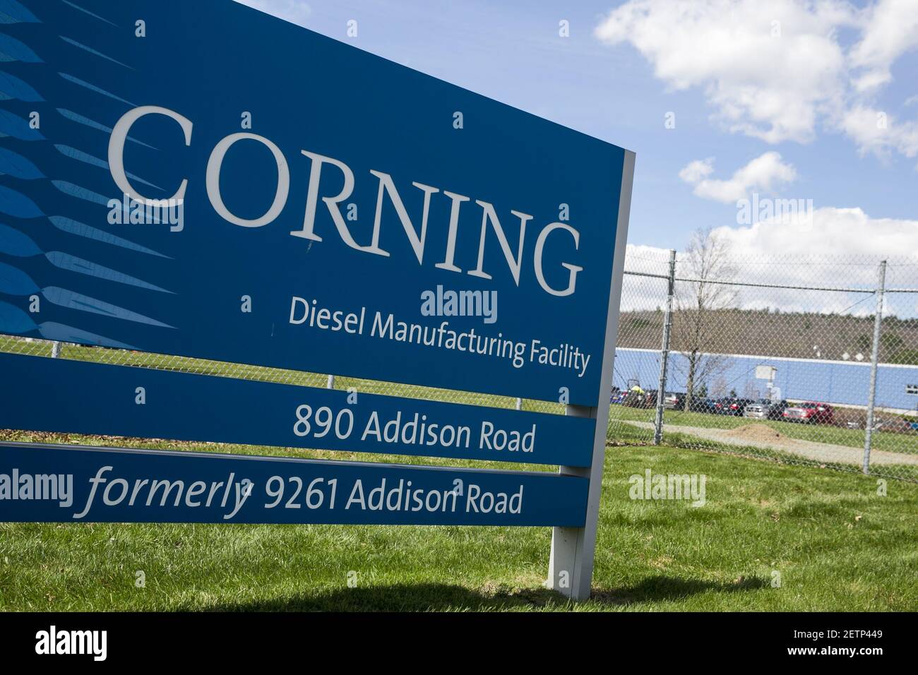 A logo sign outside of a facility occupied by Corning, Inc., in Painted ...