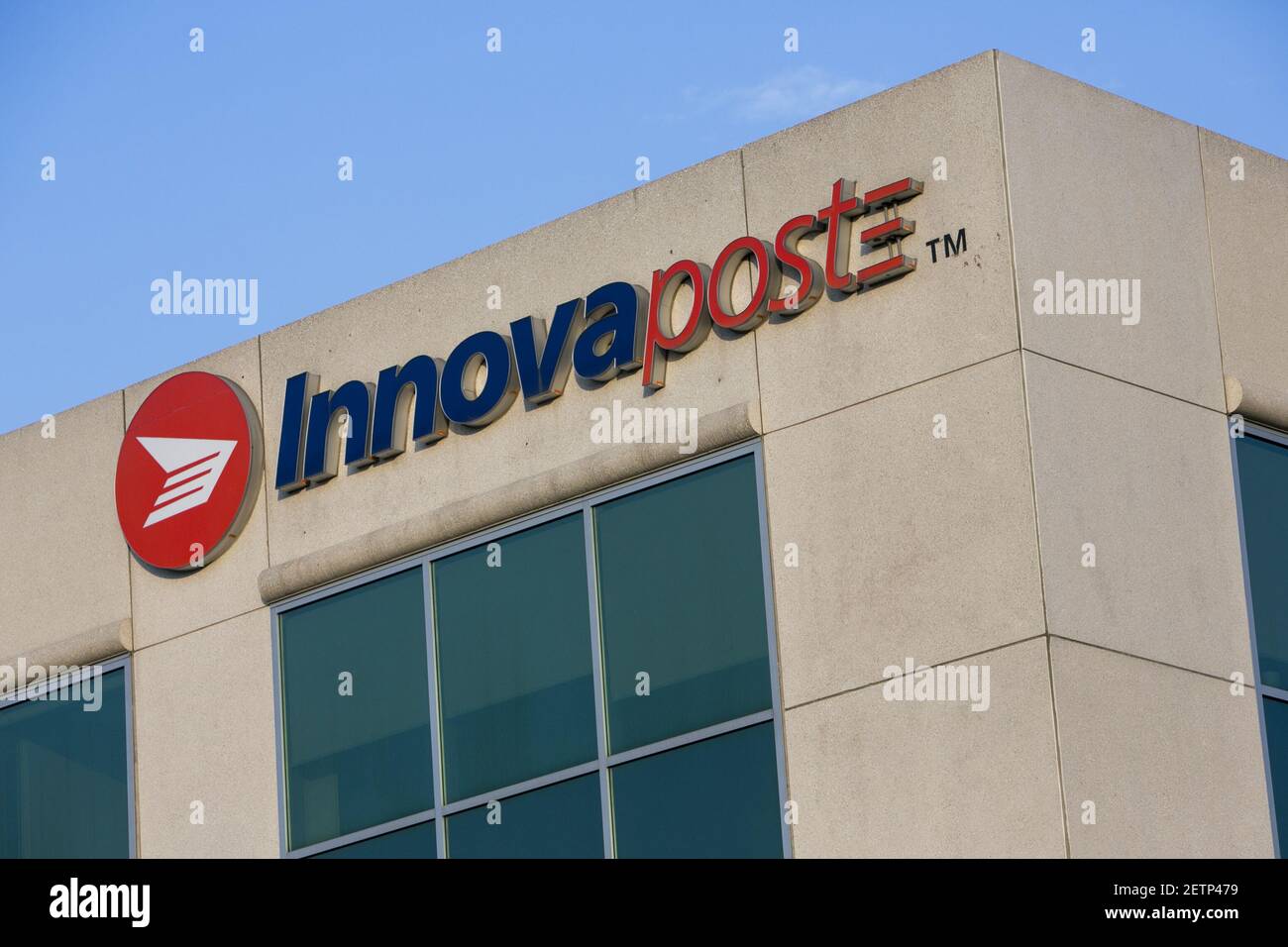 A logo sign outside of a facility occupied by Innovapost in Mississauga ...