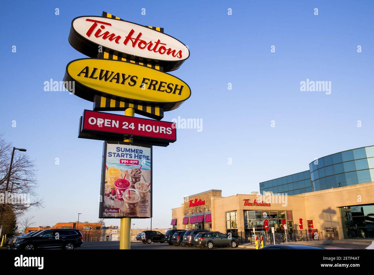 A logo sign outside of a Tim Hortons restaurant in Oakville, ON, Canada ...