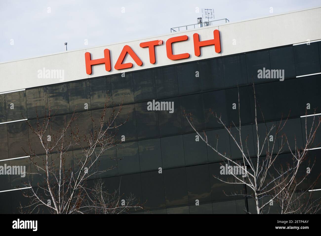 A logo sign outside of the headquarters of Hatch in Mississauga ...