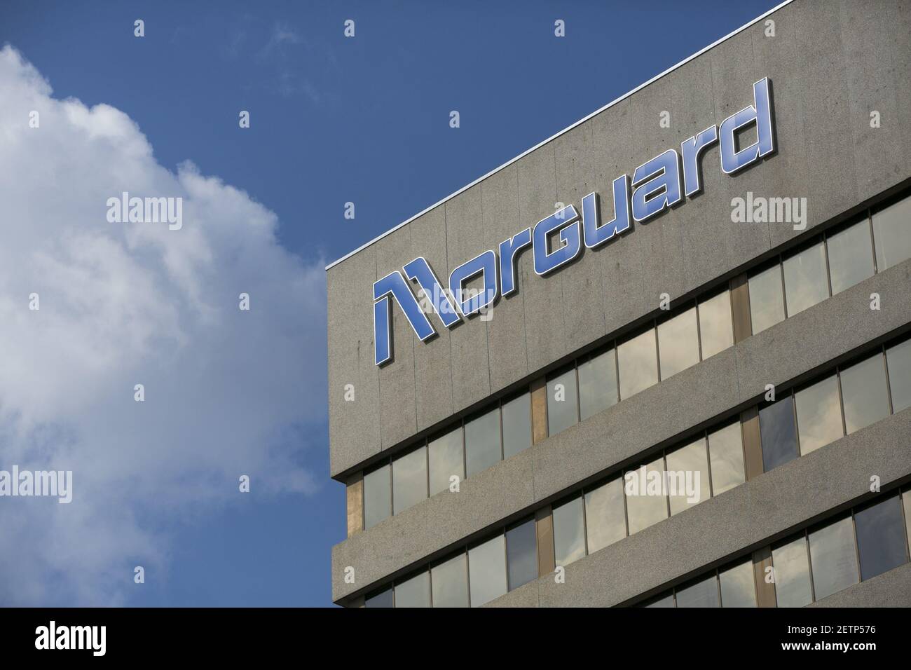 A logo sign outside of the headquarters of the Morguard Corporation in ...