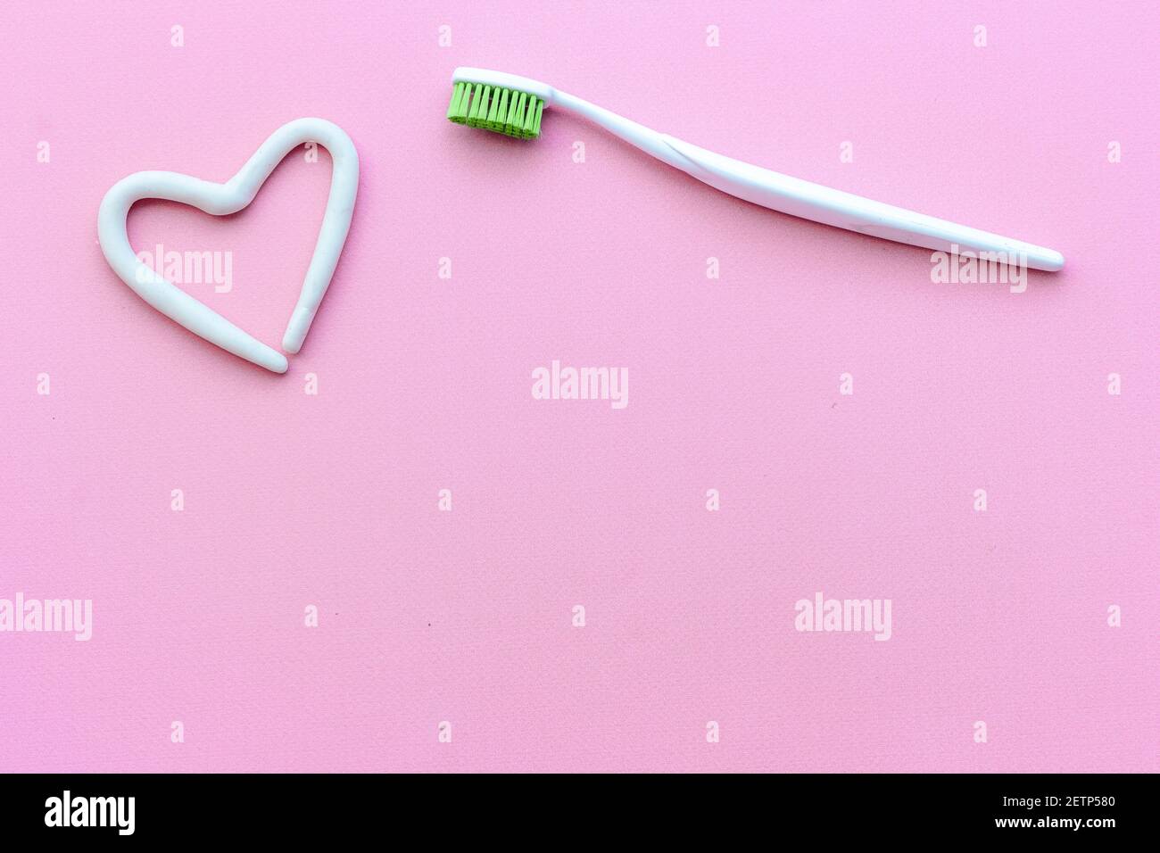 Heart shape of toothpaste with toothbrush, top view. Oral care and ...
