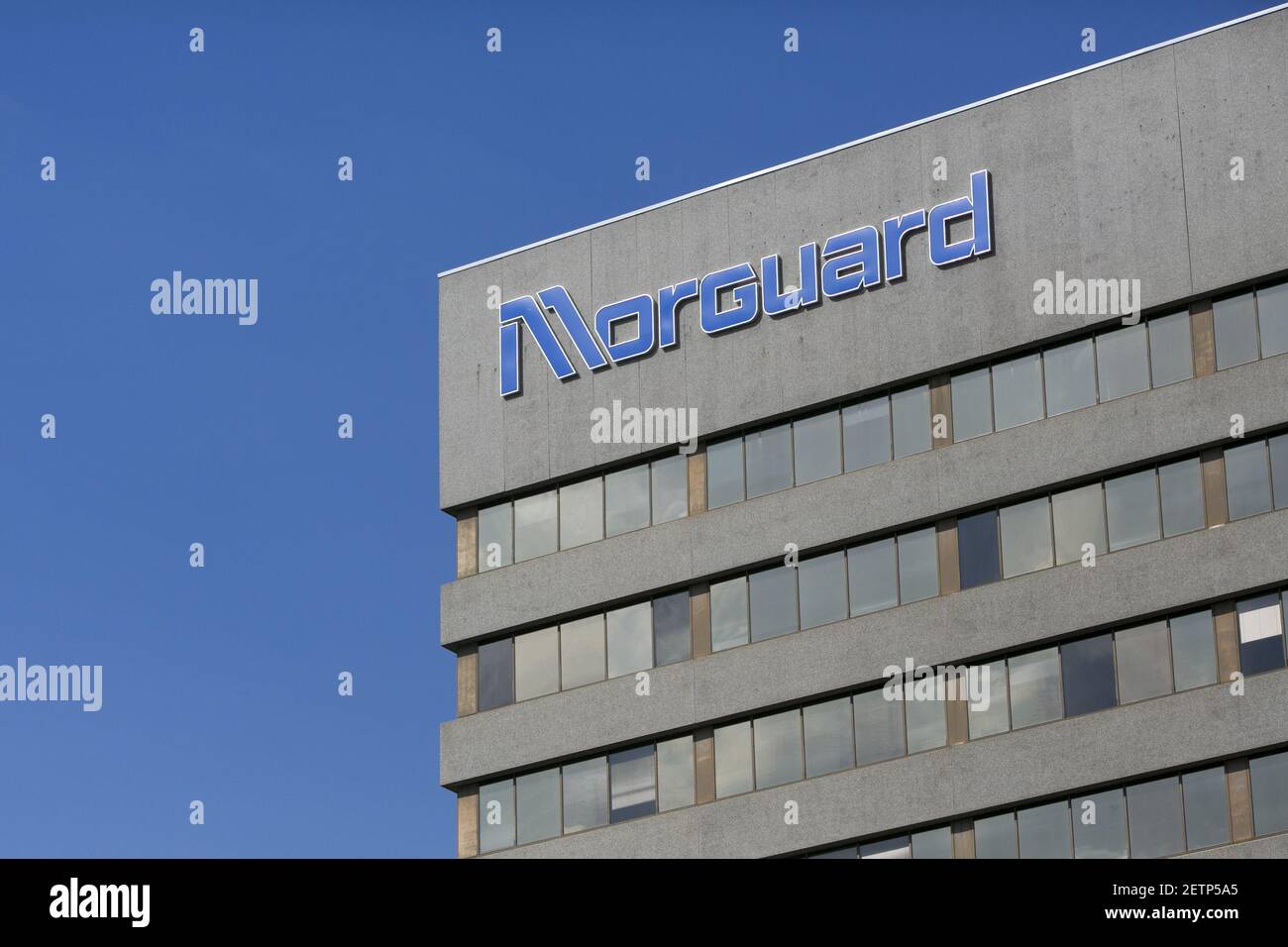 A logo sign outside of the headquarters of the Morguard Corporation in ...