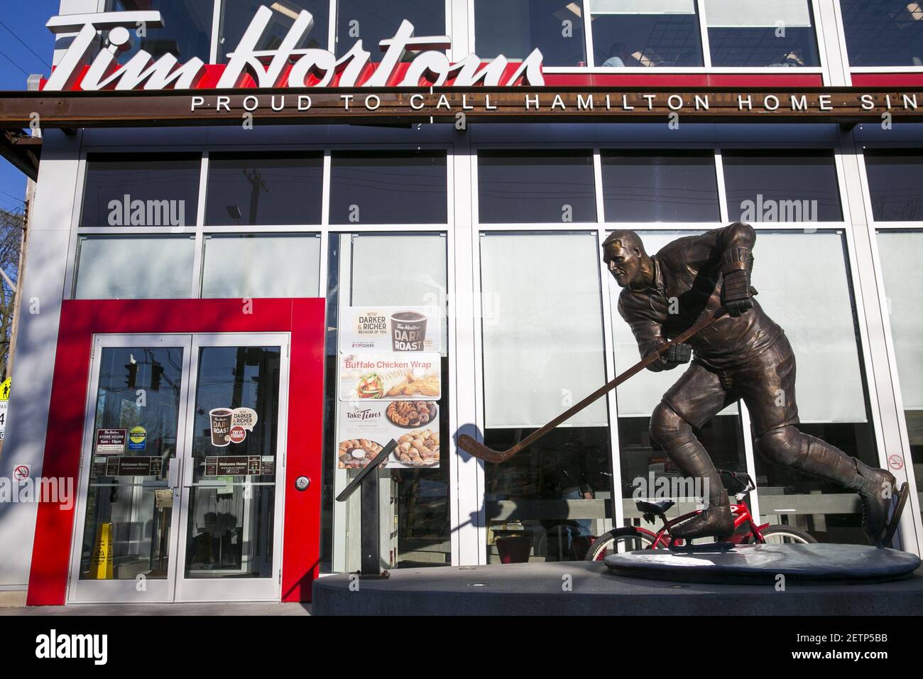 A logo sign outside of the location of the first Tim Hortons restaurant ...