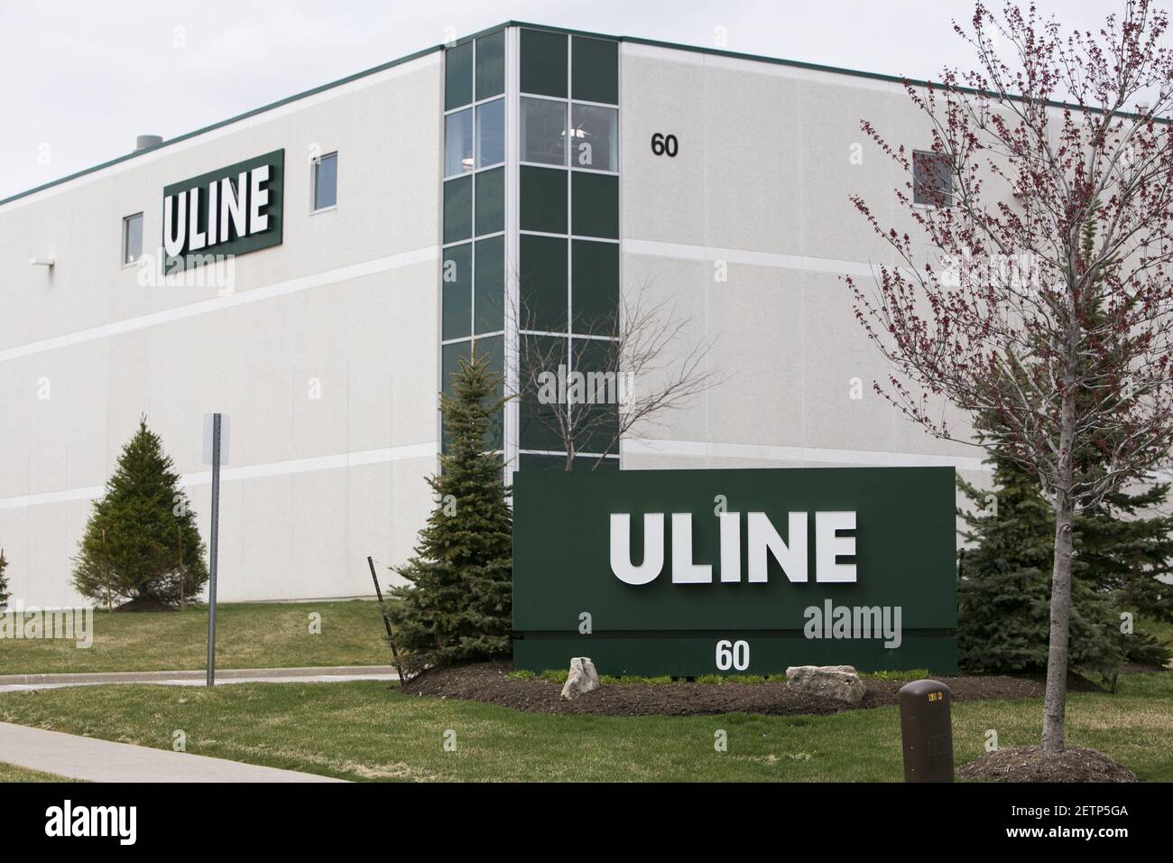 A logo sign outside of facility occupied by Uline in Brampton, Ontario ...
