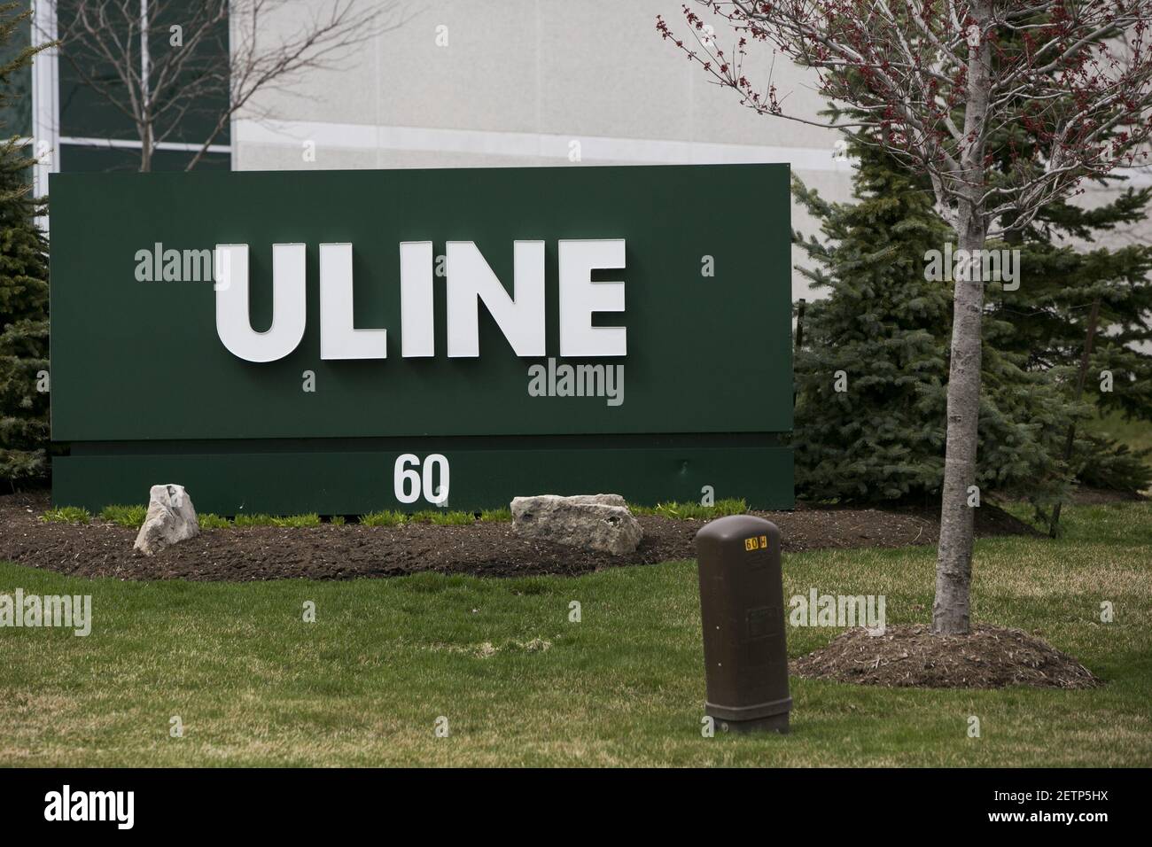 A logo sign outside of facility occupied by Uline in Brampton, Ontario ...